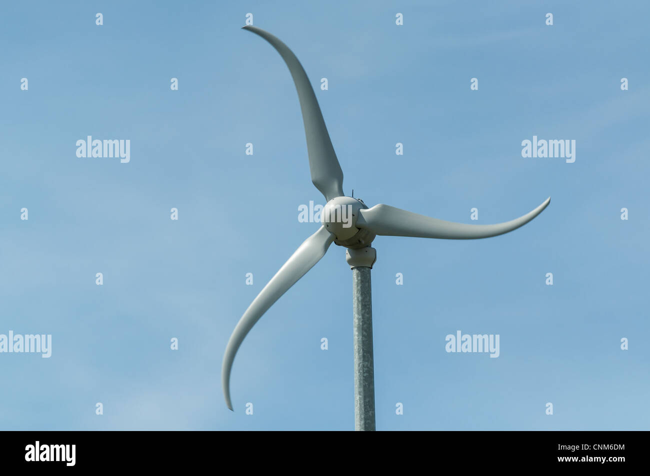 A three-bladed wind turbine spins in the wind Stock Photo - Alamy