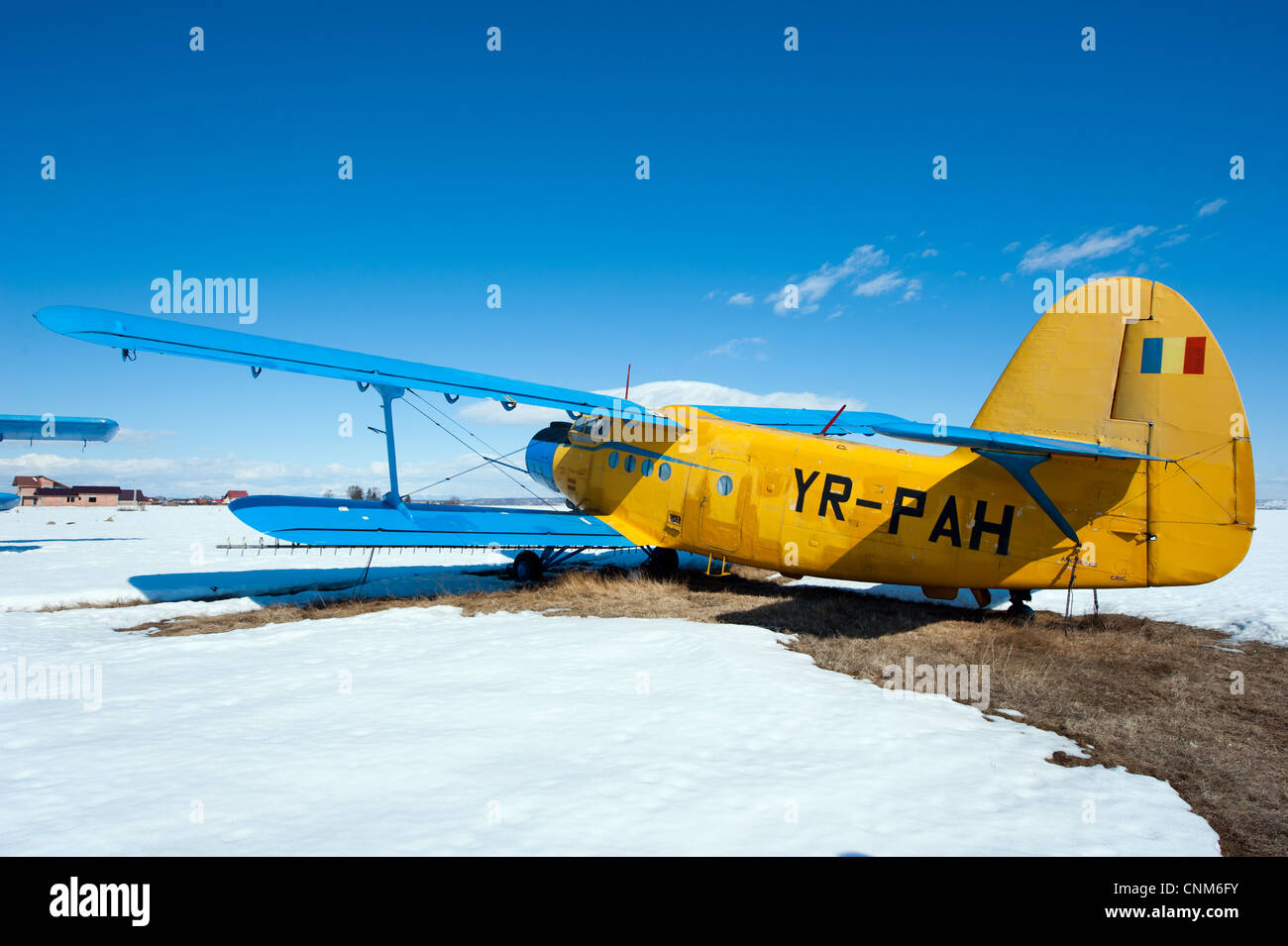 Old airplanes parked on a meadow with snow in a sunny day Stock Photo ...