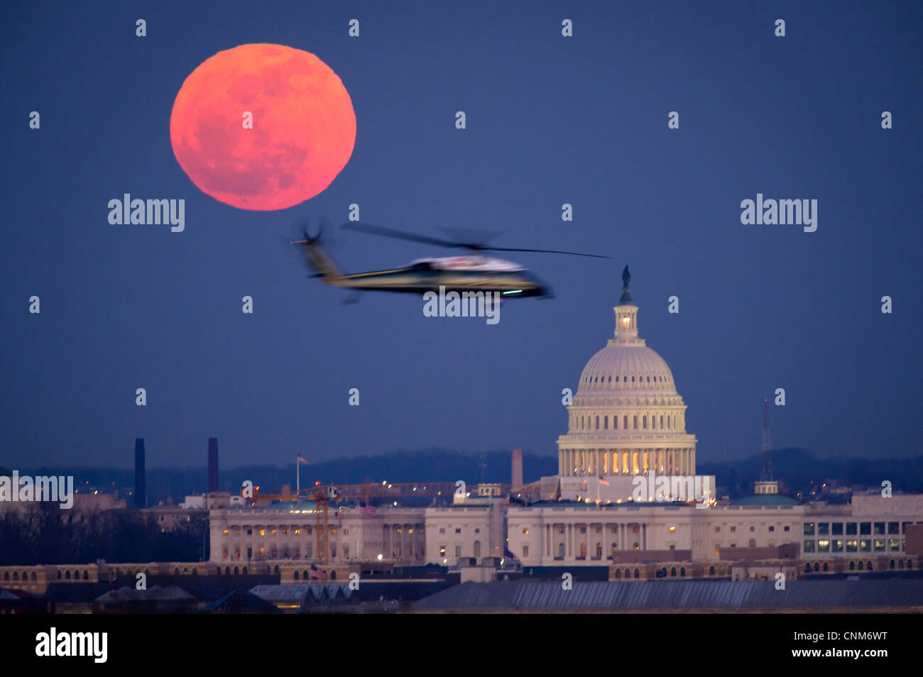 A massive full Moon rises over the US Capitol building February 7, 2012 ...