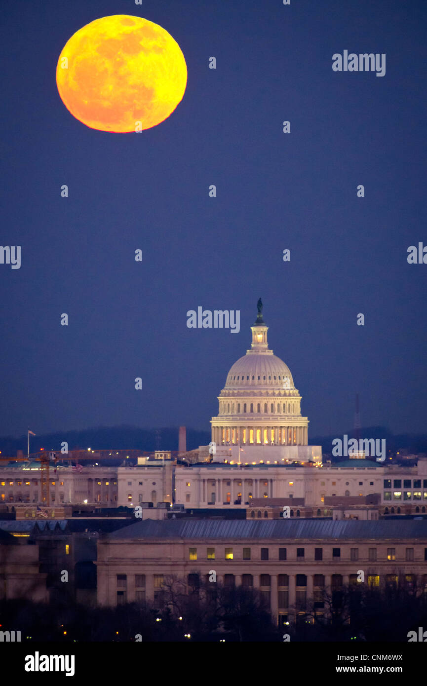 A massive full Moon rises over the US Capitol building February 7, 2012 ...