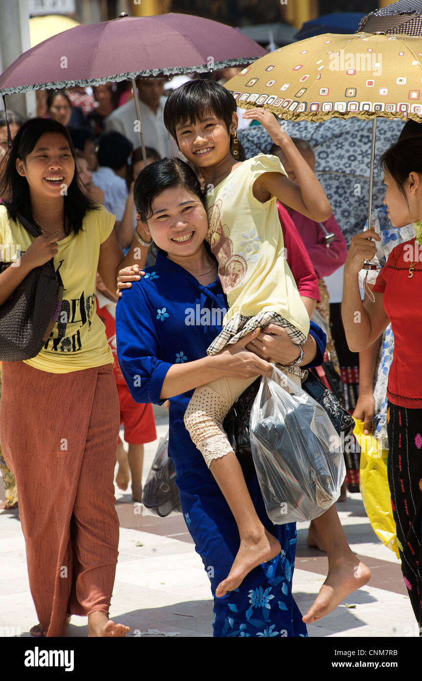 Burmese mother carrying child at Shwedagon Pagoda. Rangoon. Yangon ...