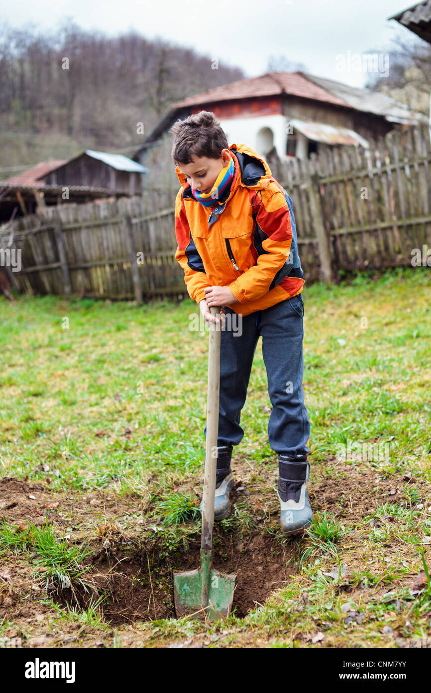 Child digging hole garden hi-res stock photography and images - Alamy