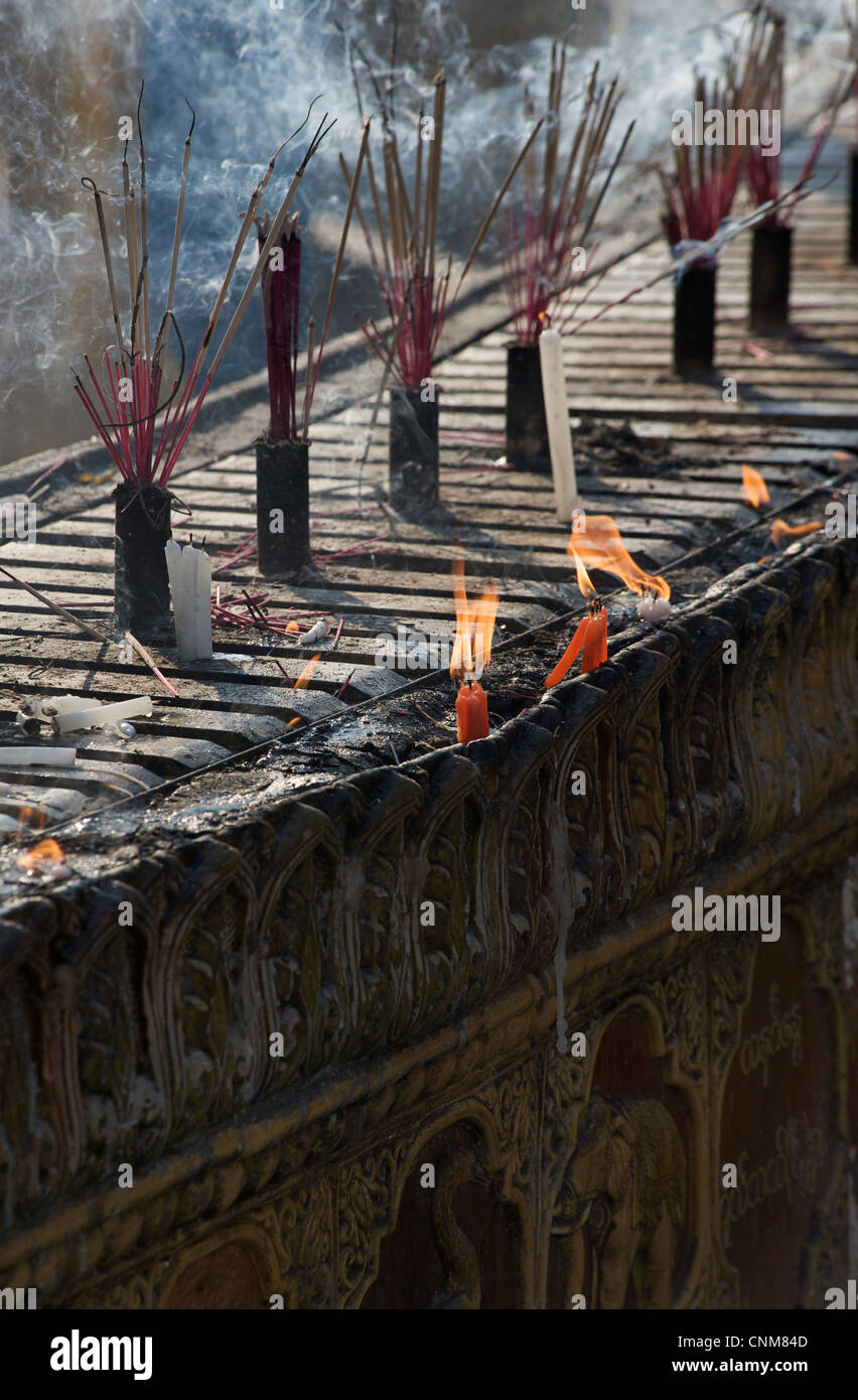 Burning joss sticks of incense at Shwedagon Pagoda, Rangoon, Burma ...