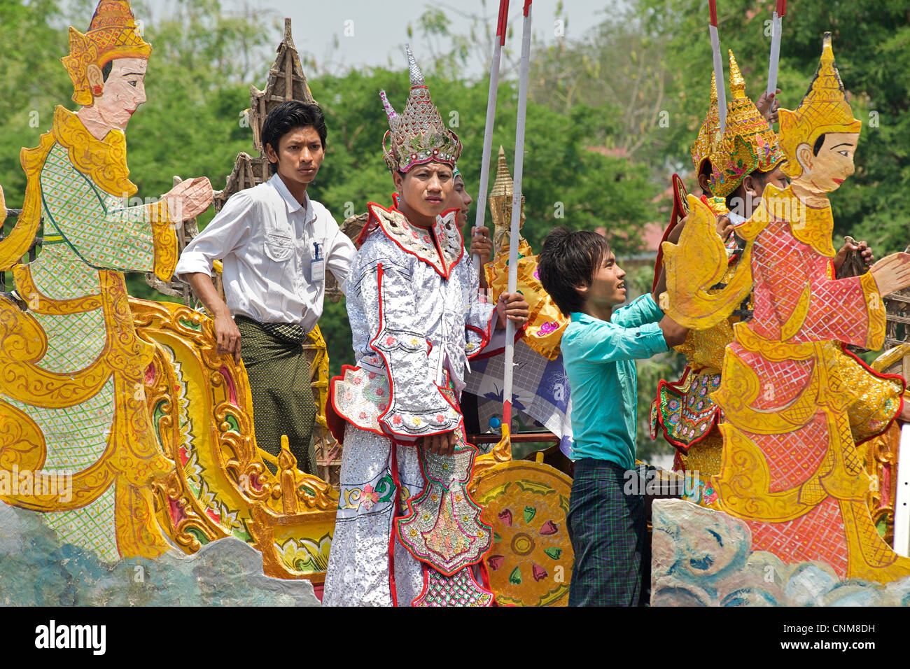 Burmese festival procession float. Dressed in traditional regalia ...
