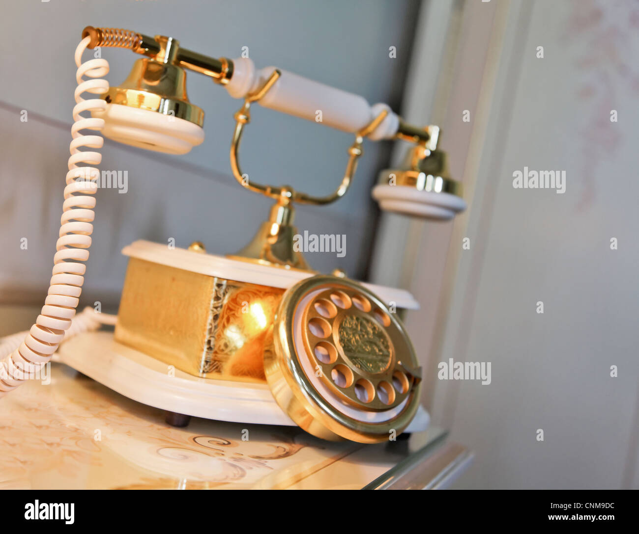 Interior design element of gold and brass ceramic telephone retro style ...