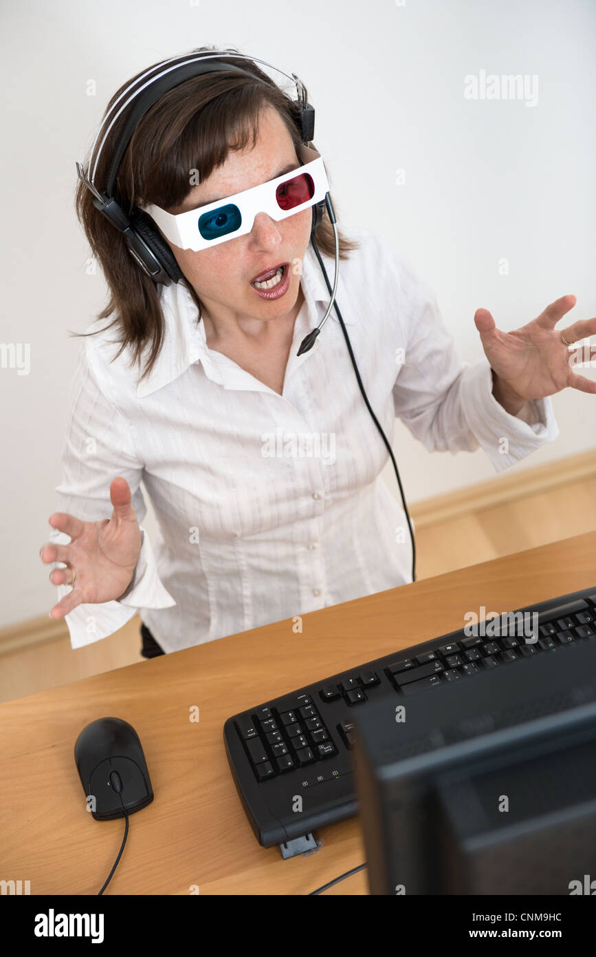Business person with 3d glasses at computer - awe expression Stock ...