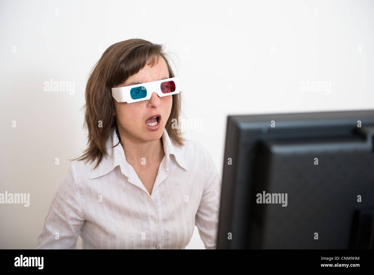 Business person with 3d glasses at computer - awe expression Stock ...
