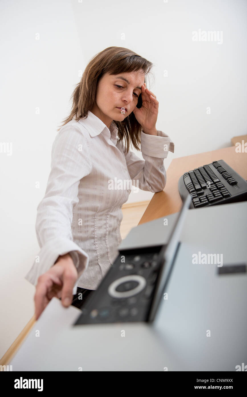 Business person in depression reaching hand and taking paper from ...