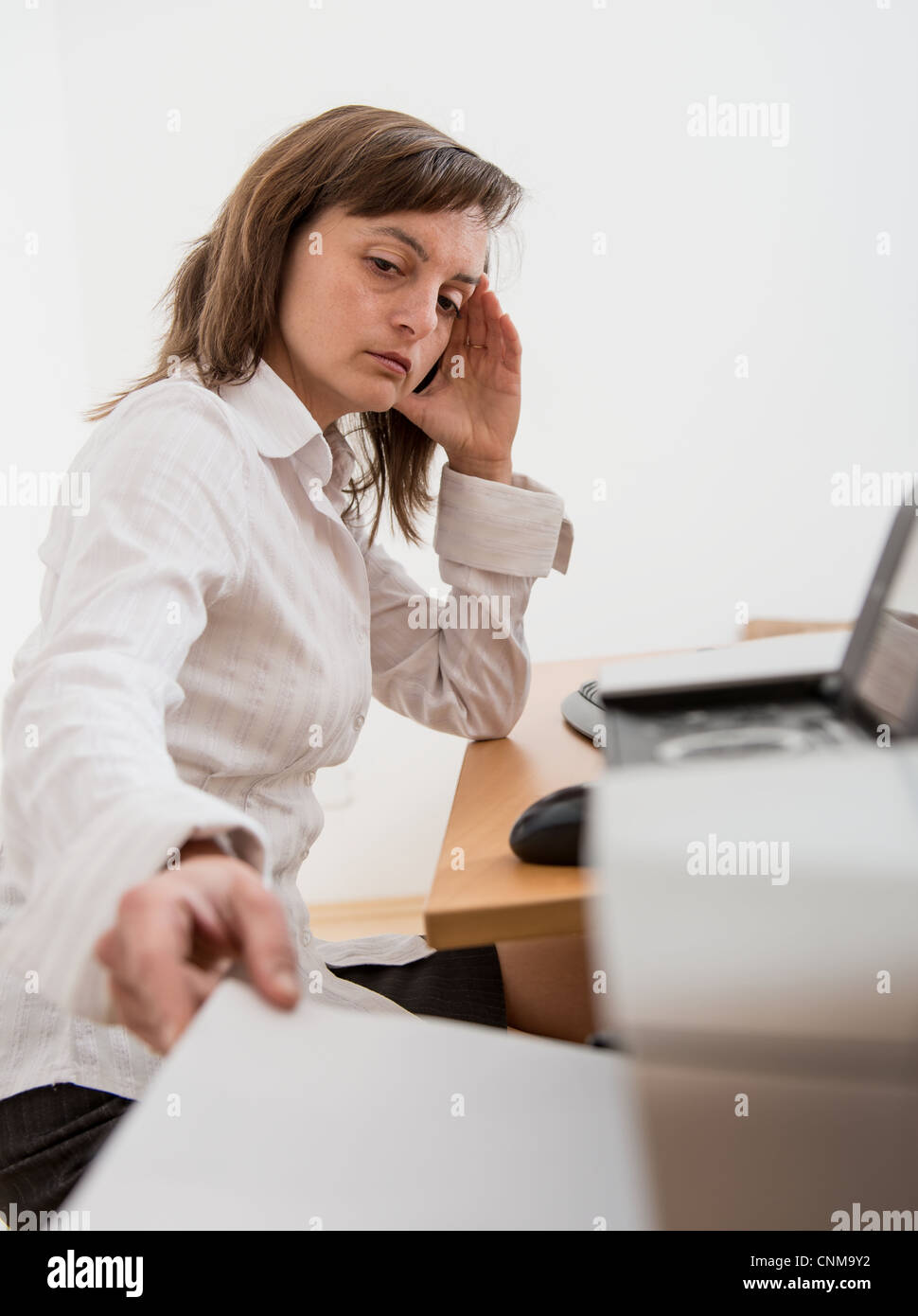 Business person in depression reaching hand and taking paper from ...