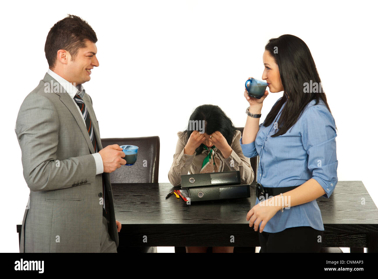 Two people drinking coffee in a break and other business woman being ...