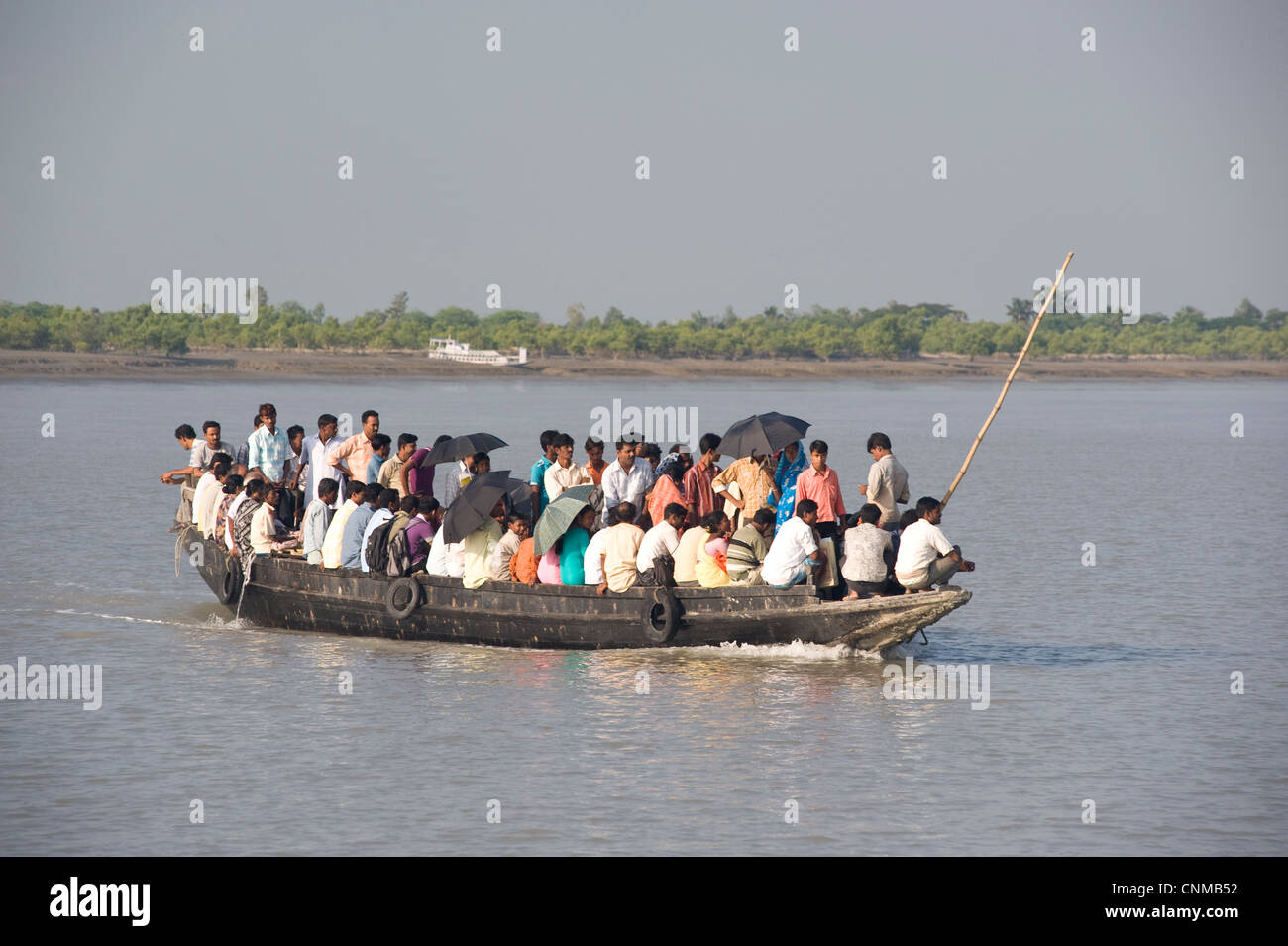 Small wooden ferry boat crowded with people, Gothakali Port, Sunderbans ...