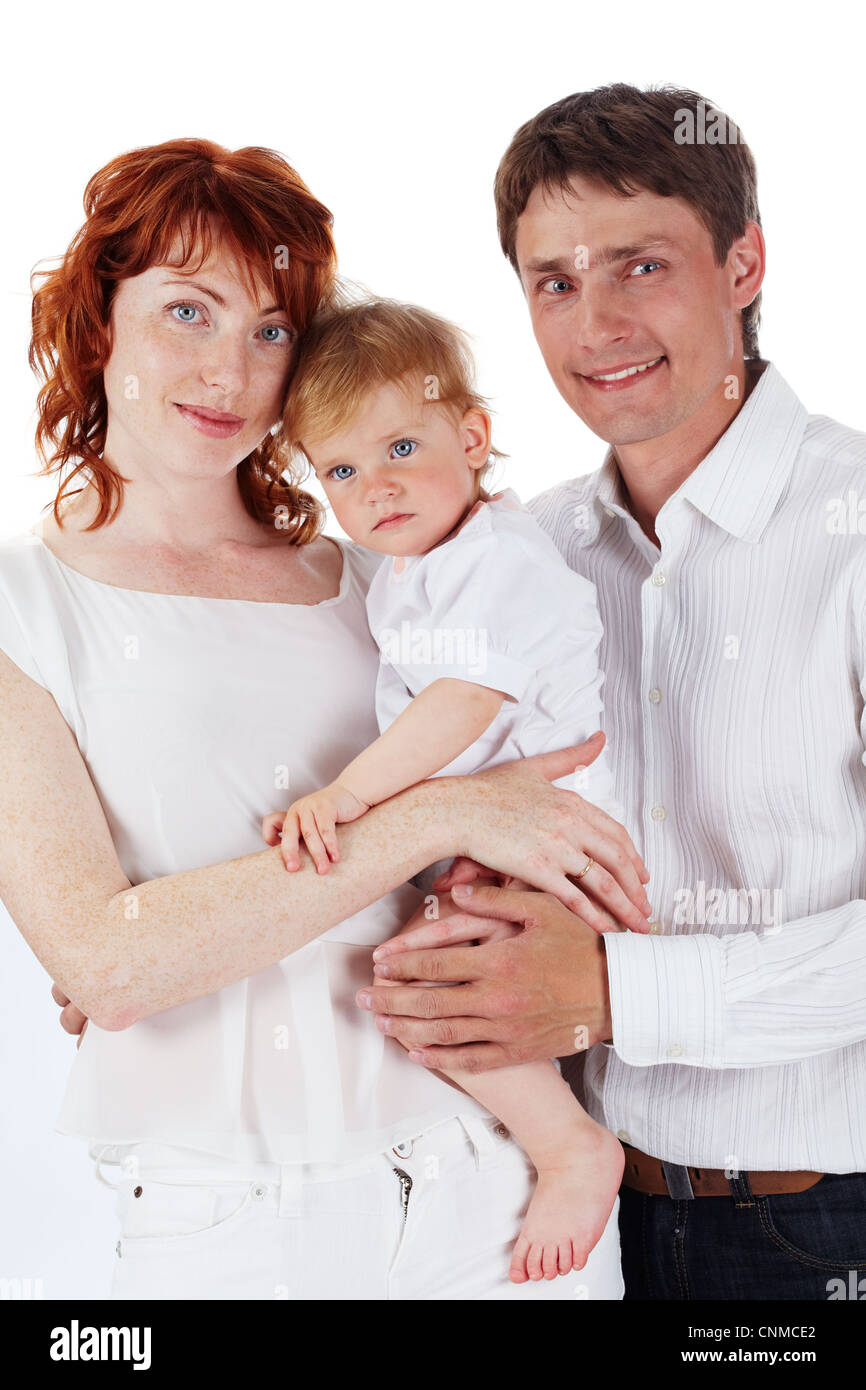 Portrait of joyful family looking at camera over white background Stock ...