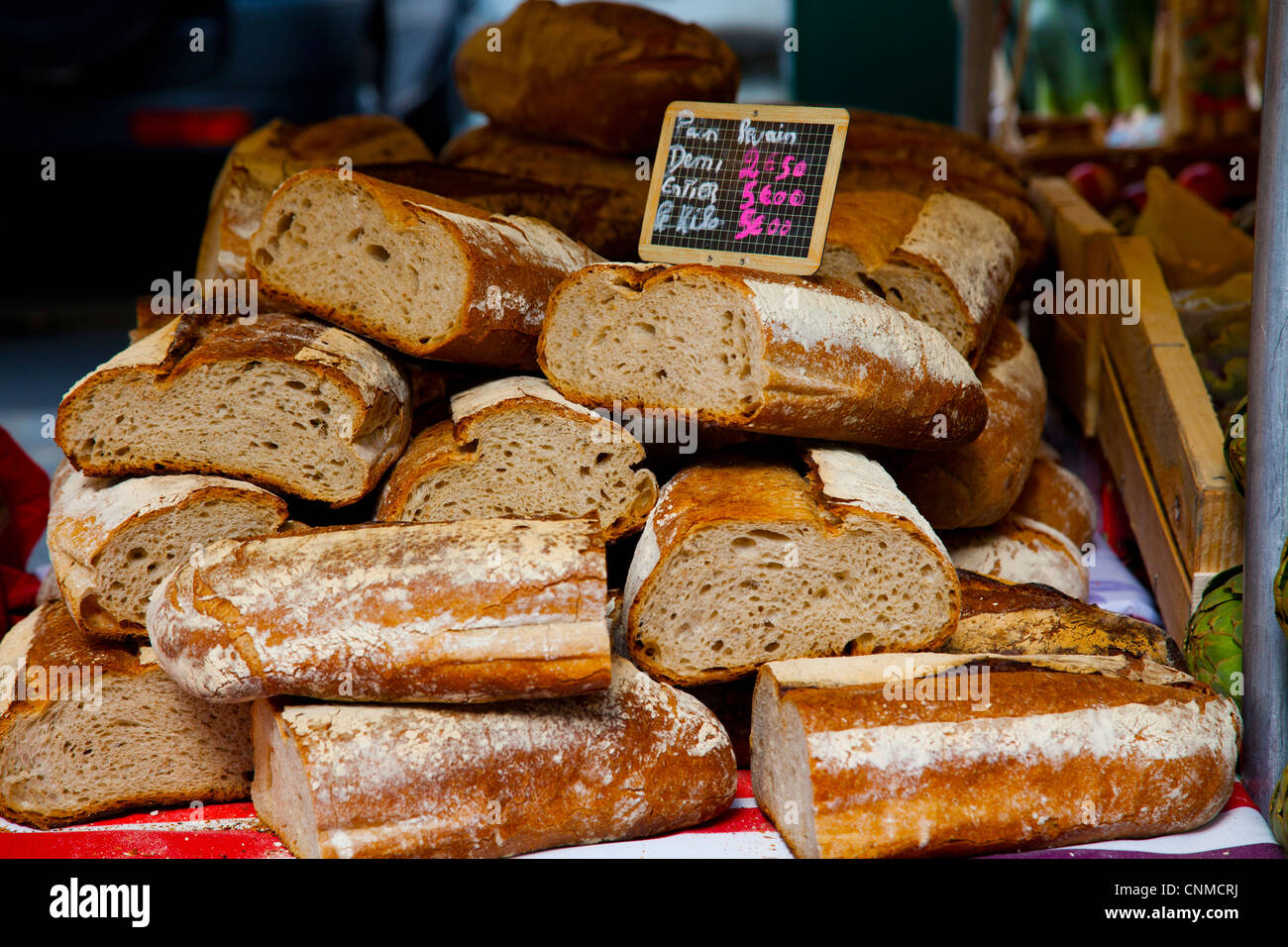 Bread displayed for sale at the Bastille market in Paris Stock Photo ...
