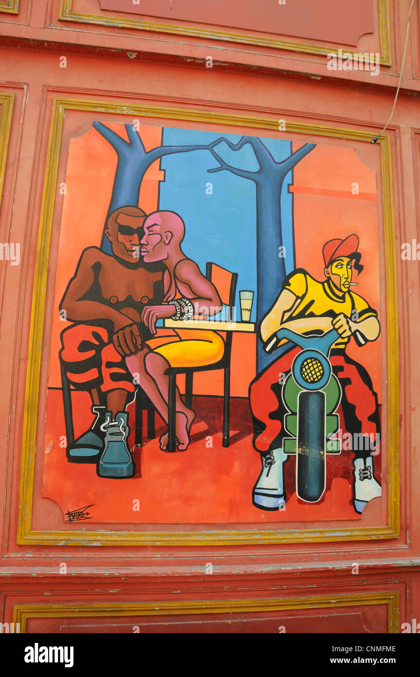A cartoon painting on the window of a bistro in the Panier quarter of ...