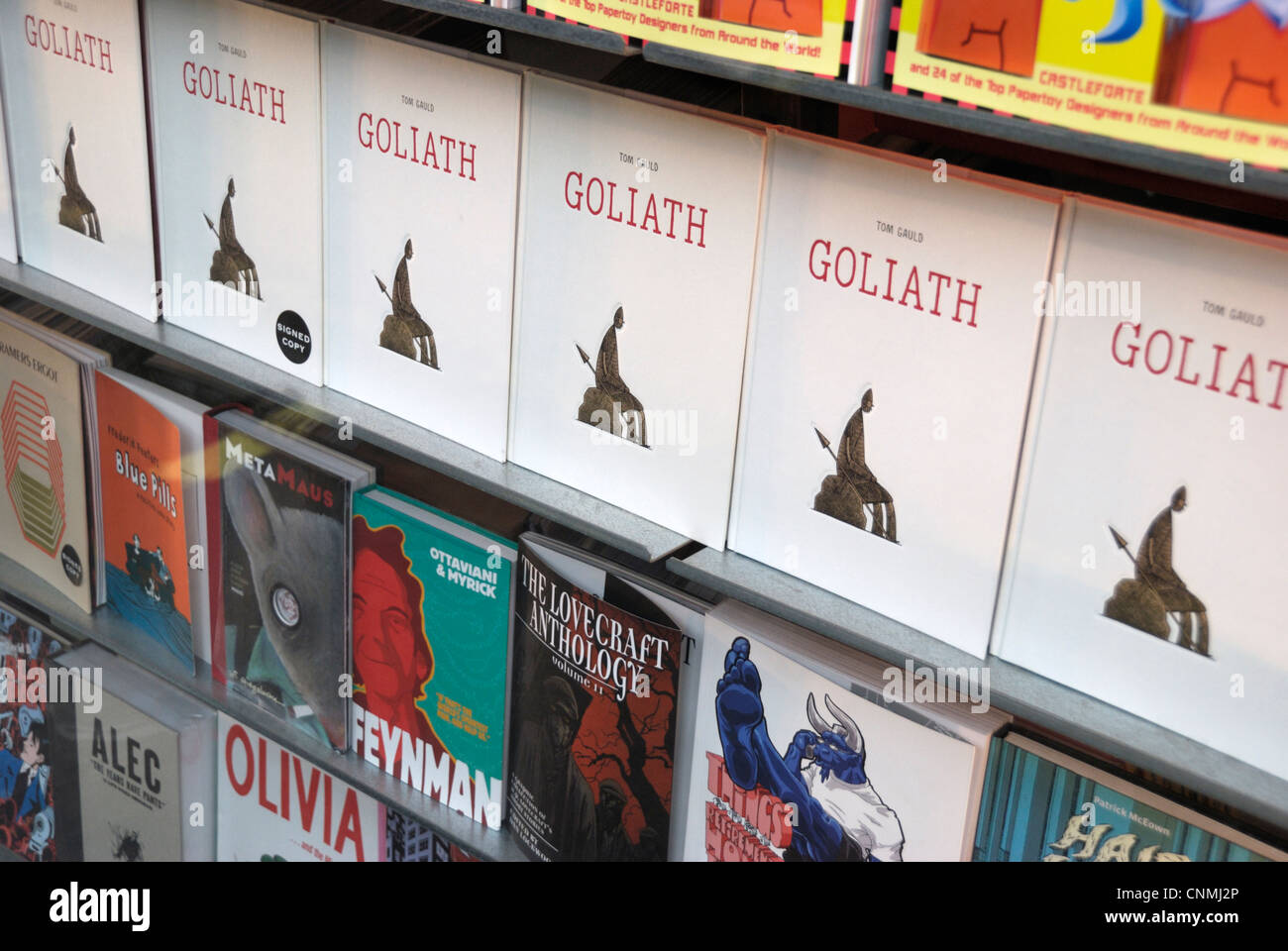 Comic books in a shop window display Stock Photo - Alamy