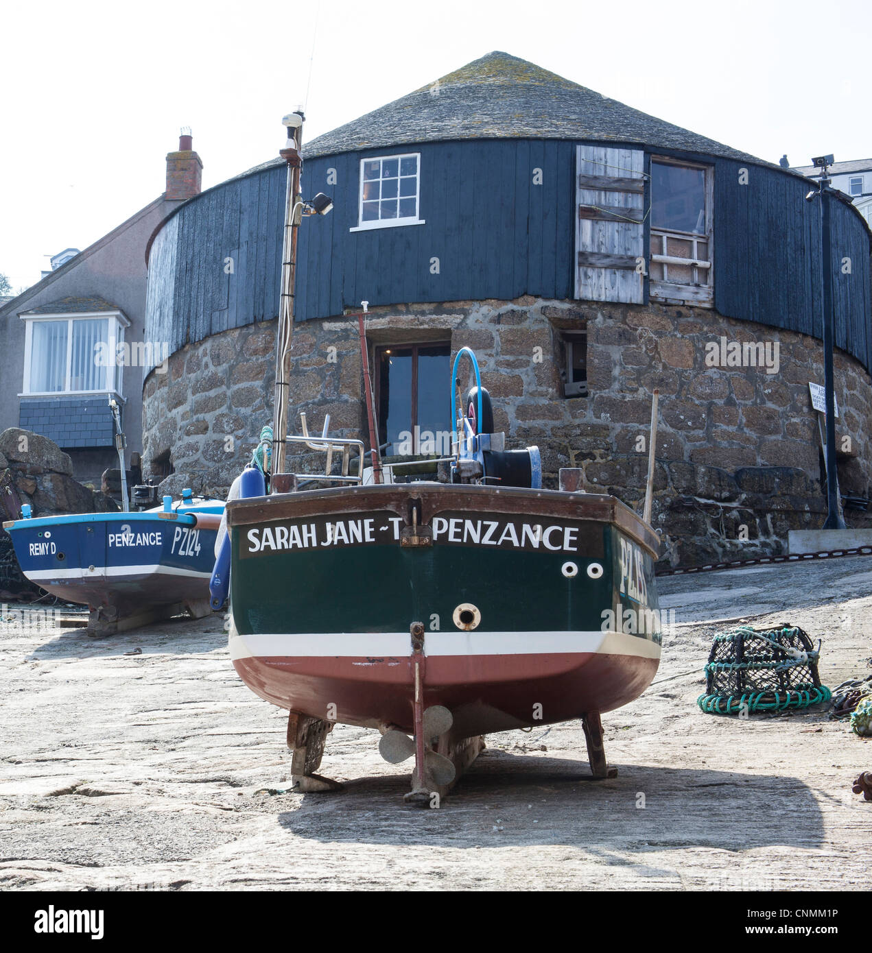 Sennen Cove harbour with fishing boat and roundhouse. Sennen Cove ...