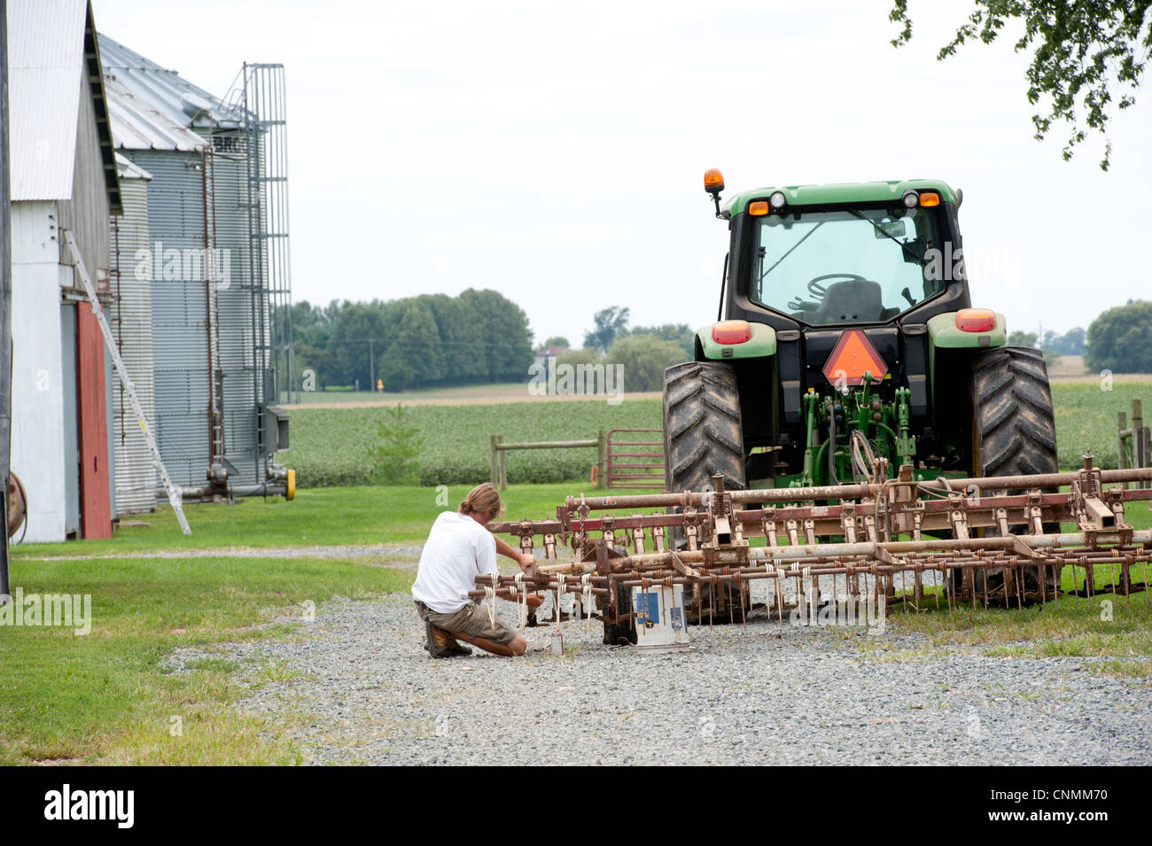 Fixing tractor hi-res stock photography and images - Alamy