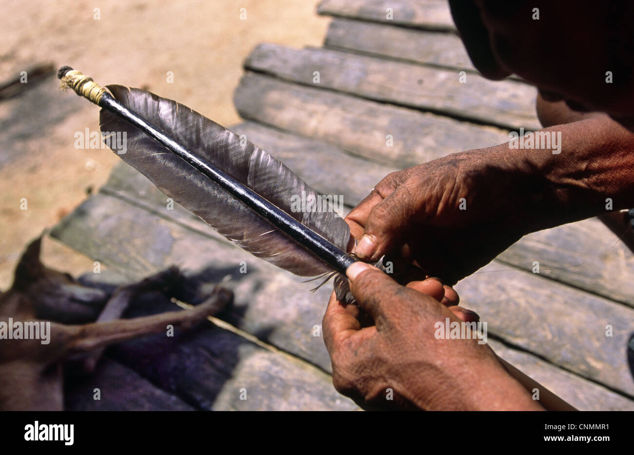 Matsés Indian man making arrows. Chobayacu river, Loreto Province, Peru ...