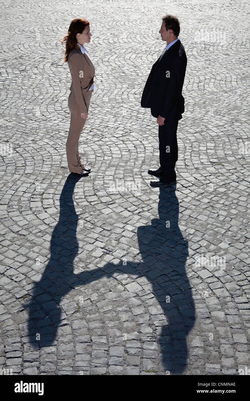 Shadows shaking hands outdoors Stock Photo - Alamy