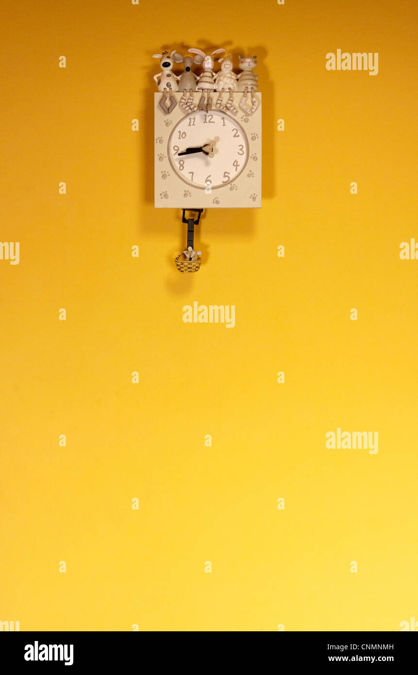 Children clock with mouse in a basket as a pendulum and some animals ...