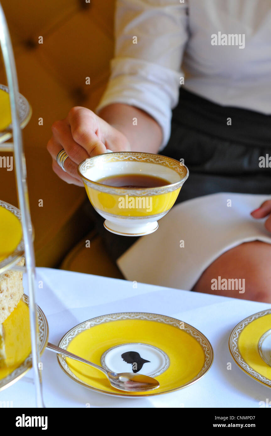 Lady drinking tea at afternoon tea, The Goring Hotel, London, England ...