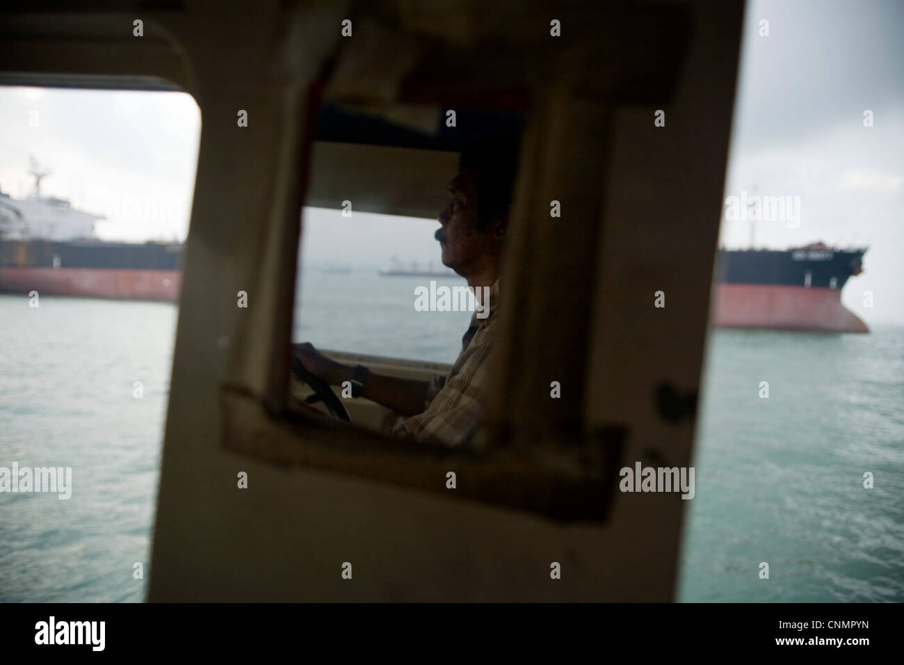 Cargo ship navigates past hi-res stock photography and images - Alamy