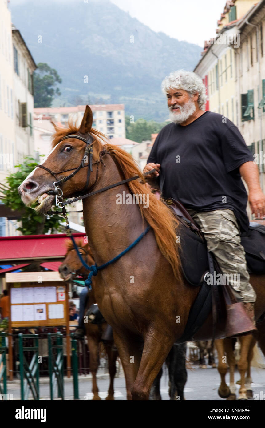 A corsican man on horseback in Corte Corsica France Stock Photo - Alamy