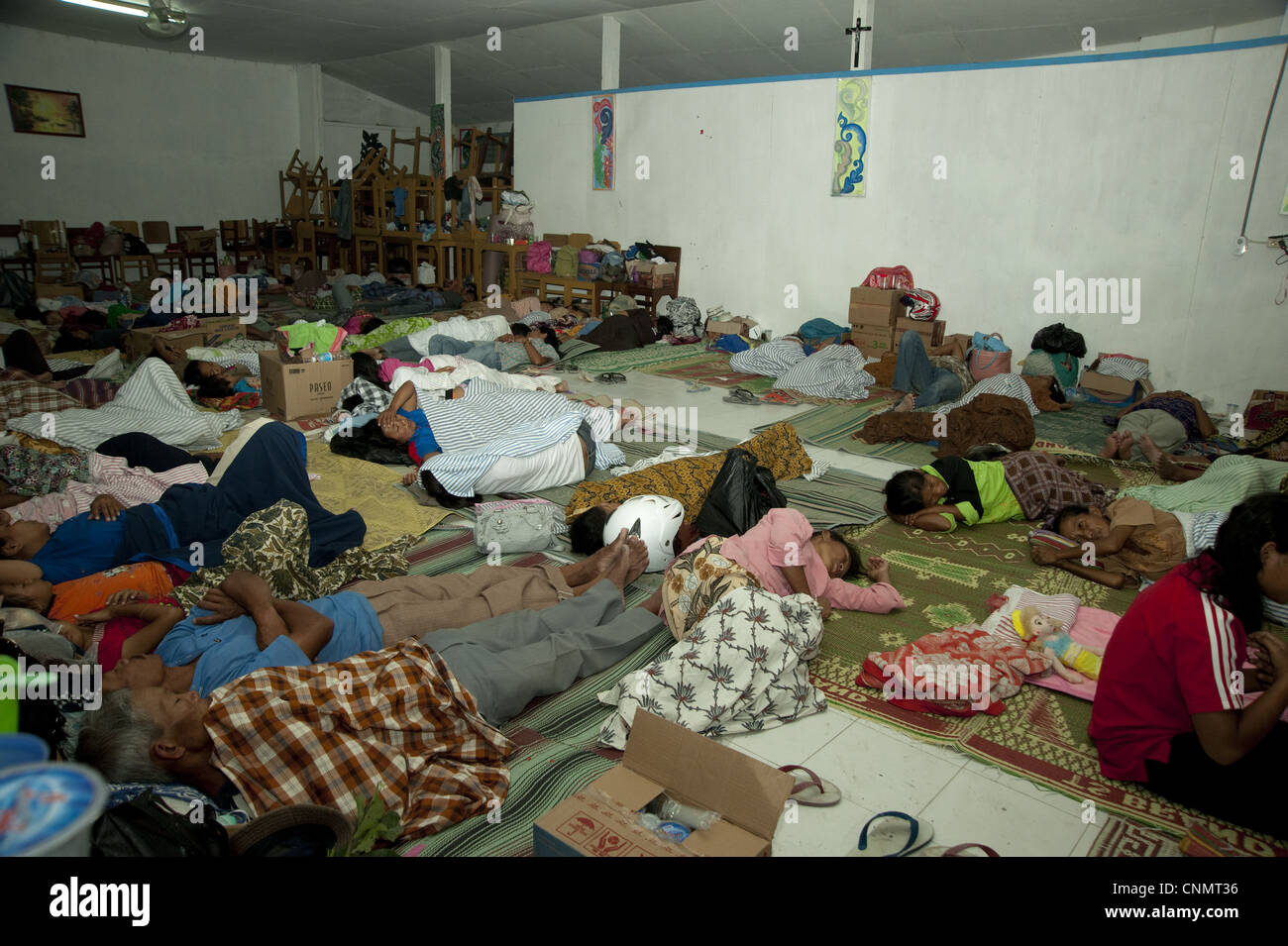 Refugees recent volcanic eruption sleeping in dormitory near Jogyakarta ...