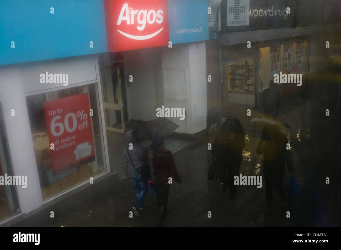 Aerial view through misted bus window of Argos branch and Londoners ...