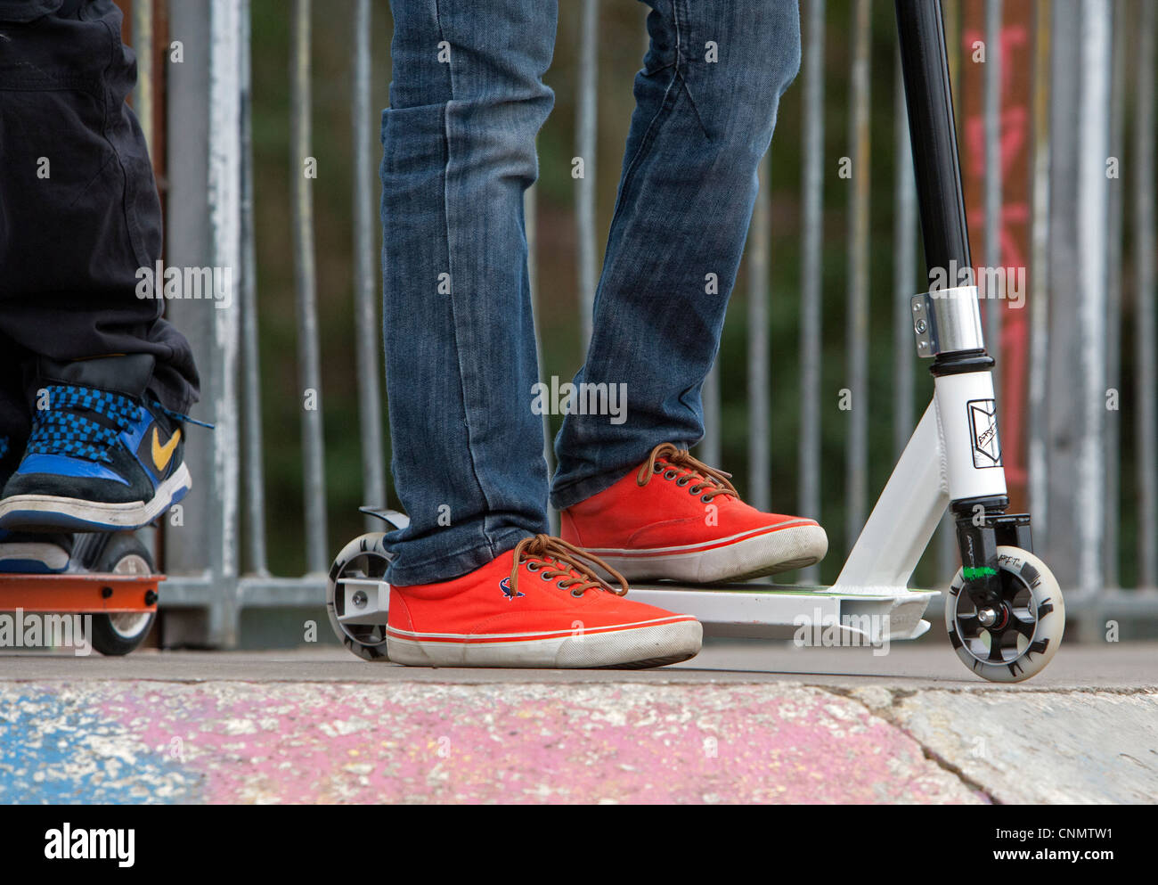Stunt scooters with riders' feet Stock Photo - Alamy