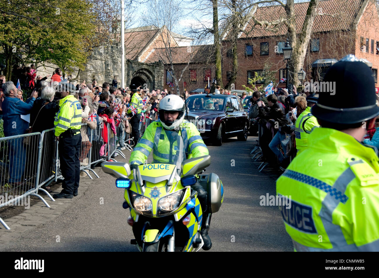 Police officer motorbike outriders escort escorting the Queen's car ...