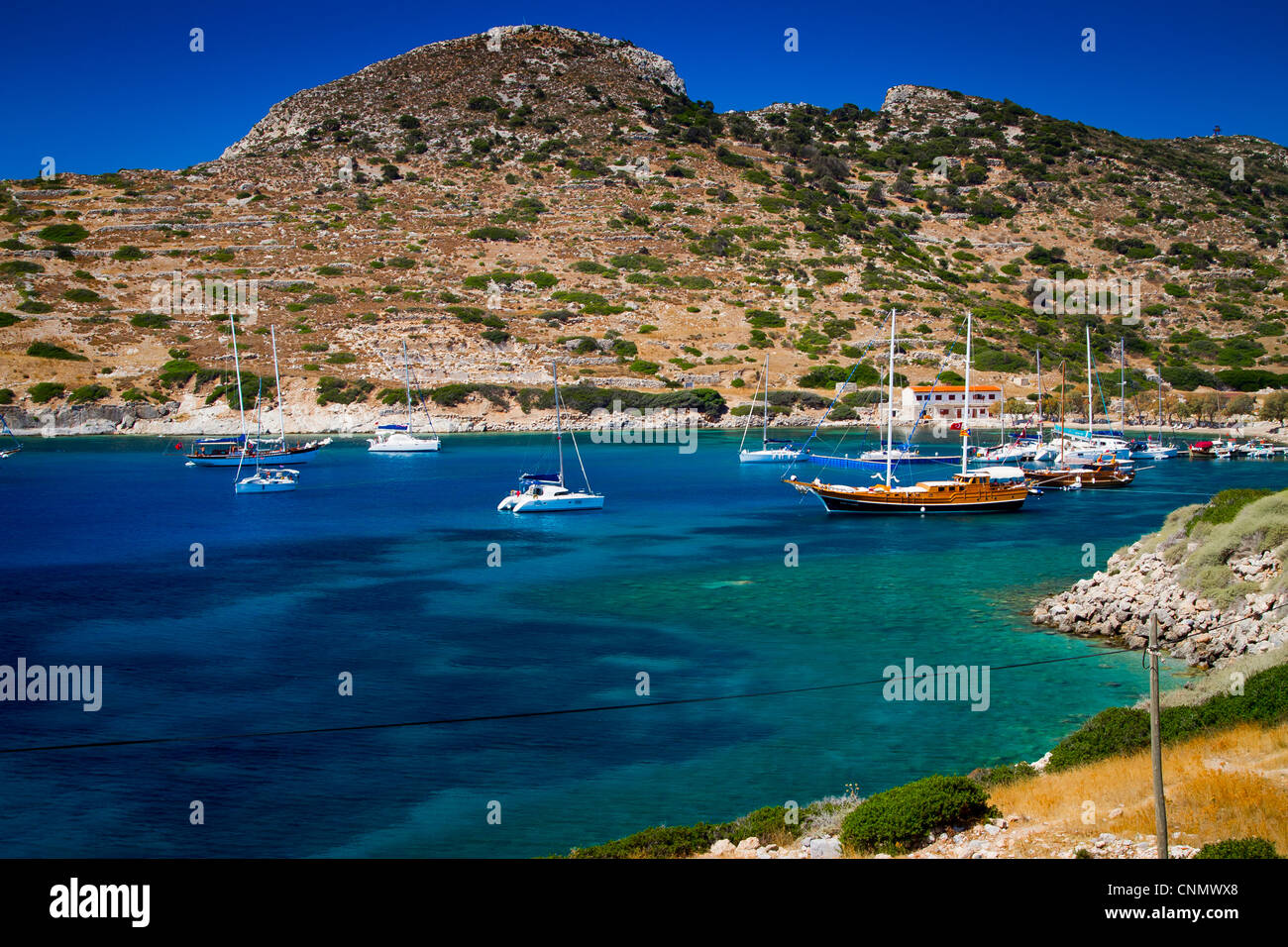 Bay and sailing ships in Knidos ancient Greek city ruins. Datca peninsula, Mugla province ...