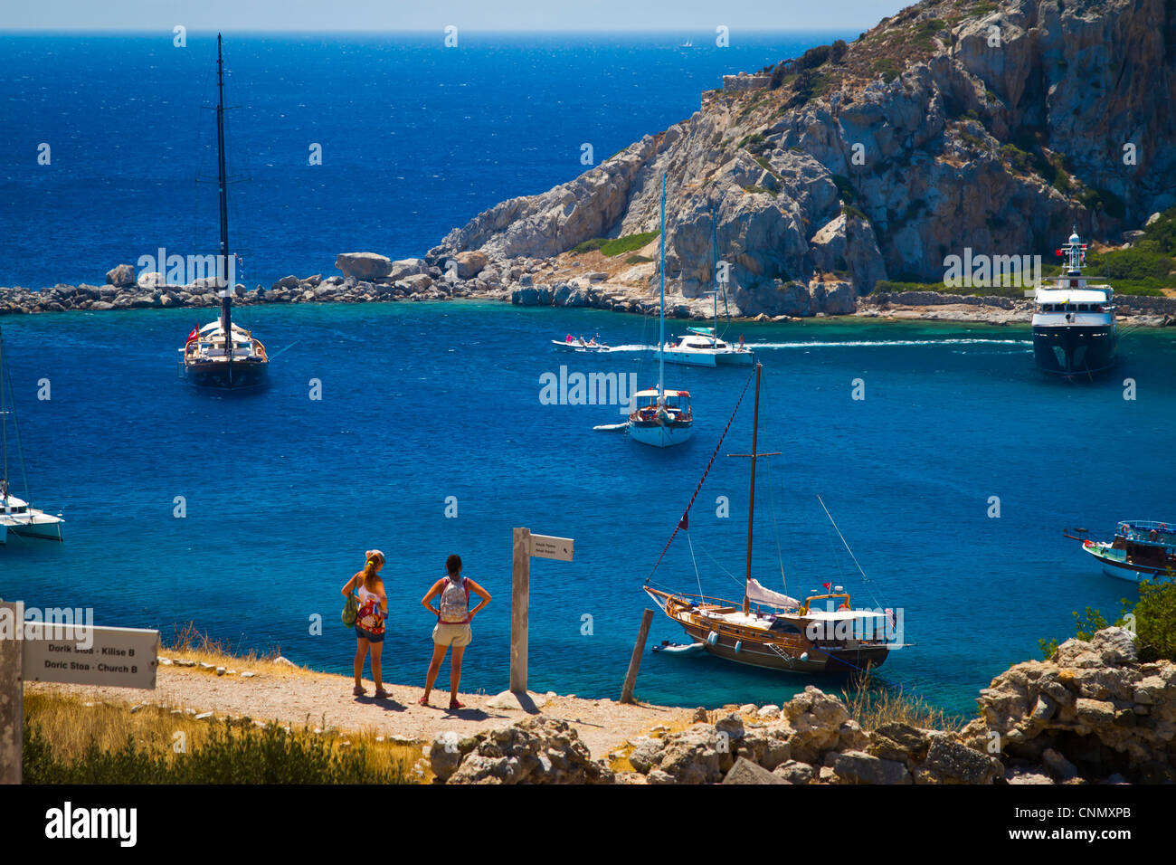 Bay and sailing ships in Knidos ancient Greek city ruins. Datca peninsula, Mugla province ...