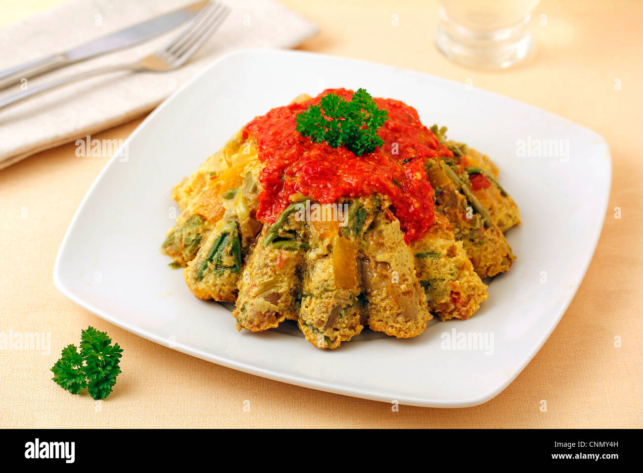 Seafood and vegetables pudding. Recipe available Stock Photo - Alamy