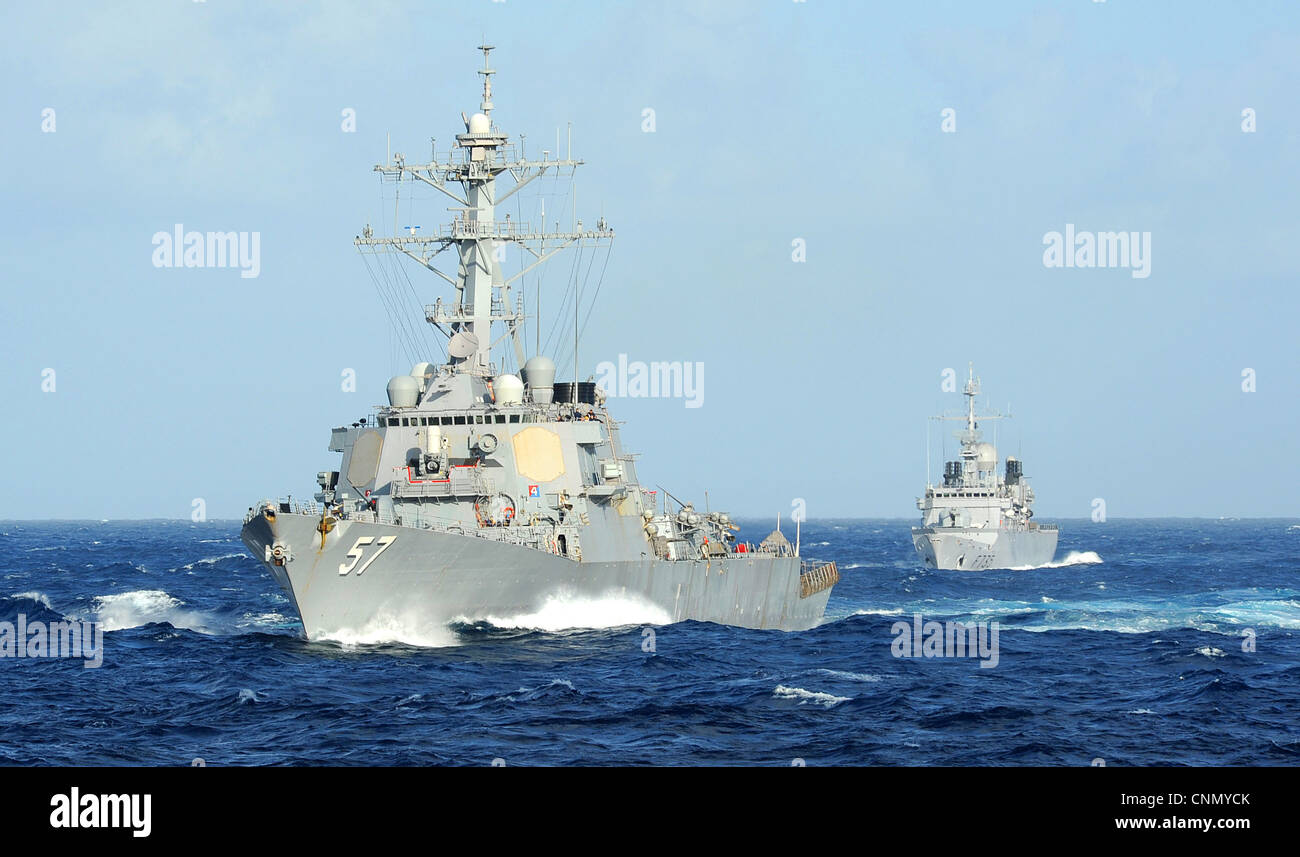 The guided-missile destroyer USS Mitscher (DDG 57), left, and the ...