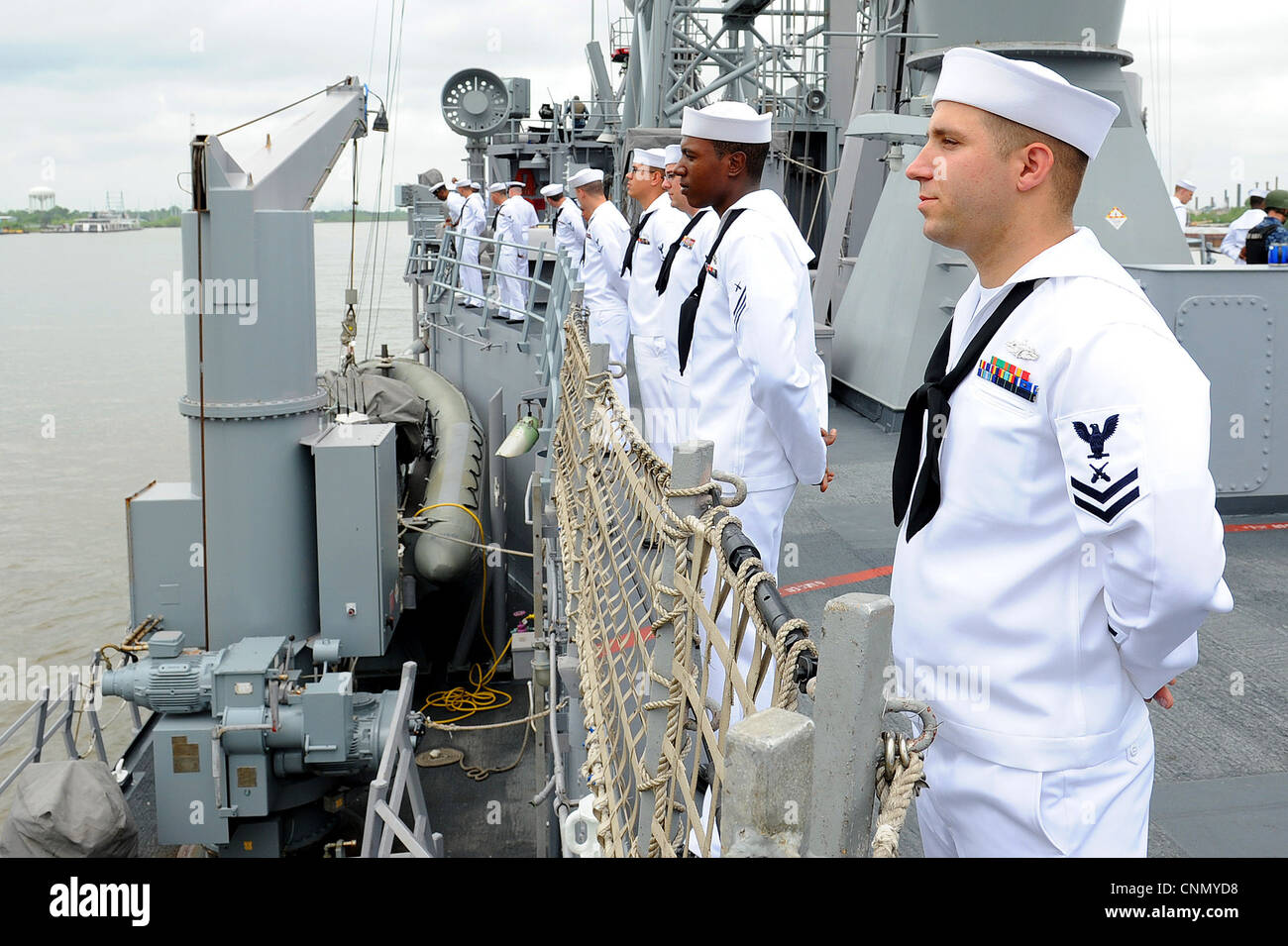 Sailors man the rails aboard the guided-missile frigate USS De Wert ...