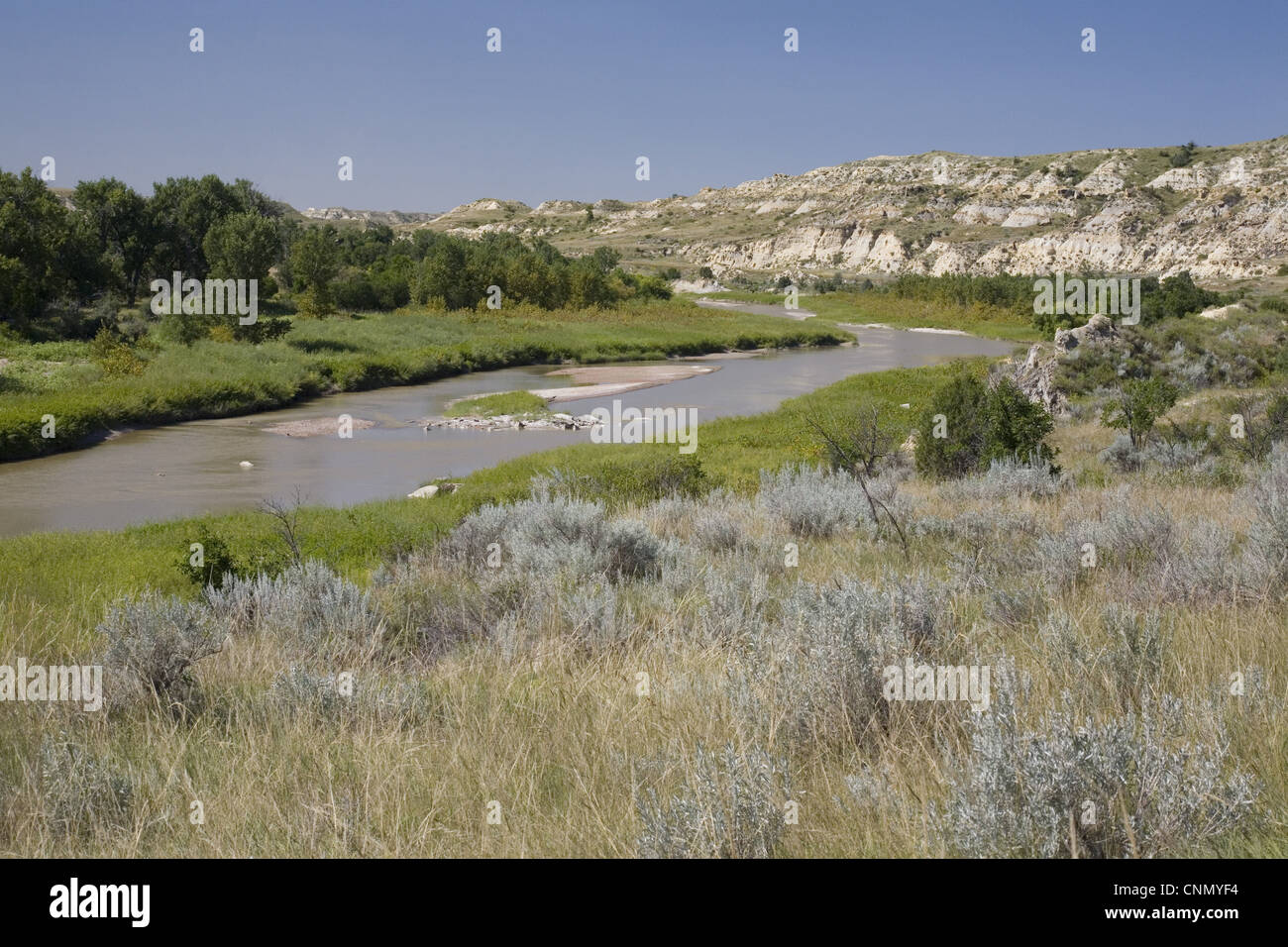 View of river flowing through ranch country, Little Missouri River ...