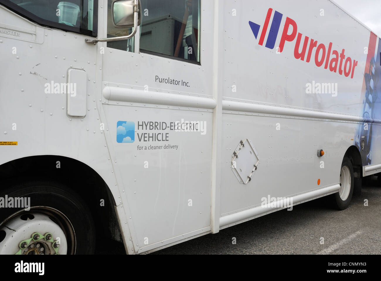 Purolator hybrid delivery trucks Stock Photo - Alamy