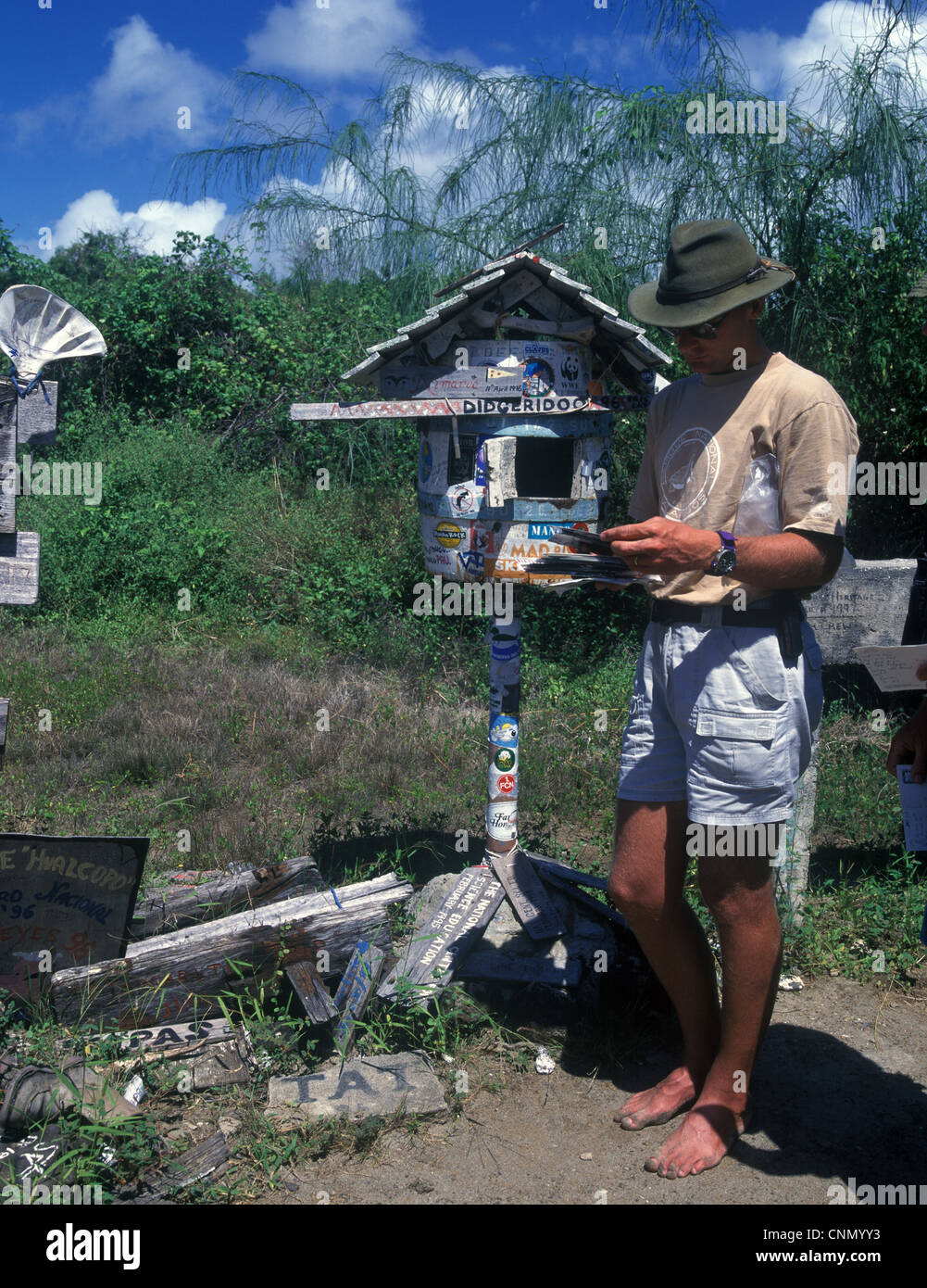 Galapagos Collecting post from the barrel at Post Office Bay ...