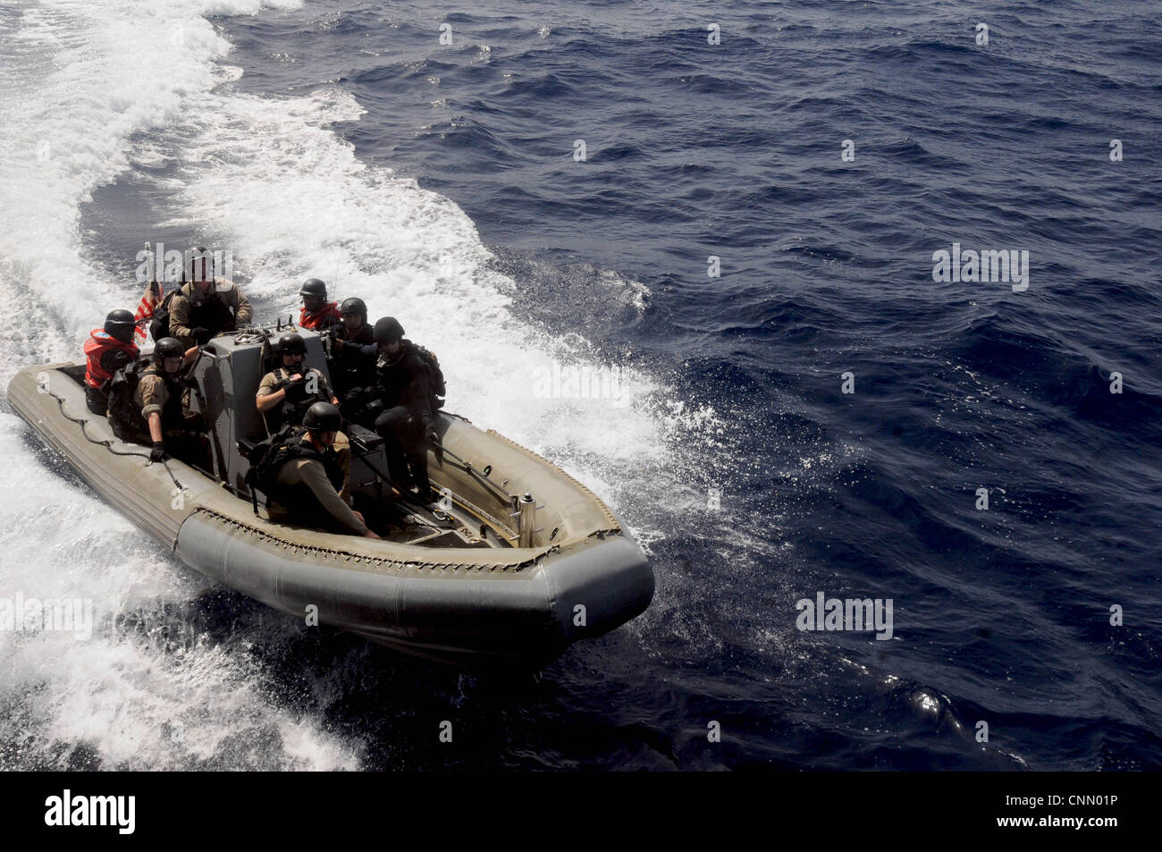 U.S. Coast Guardsmen, sailors and members of Cape Verde’s boarding team ...