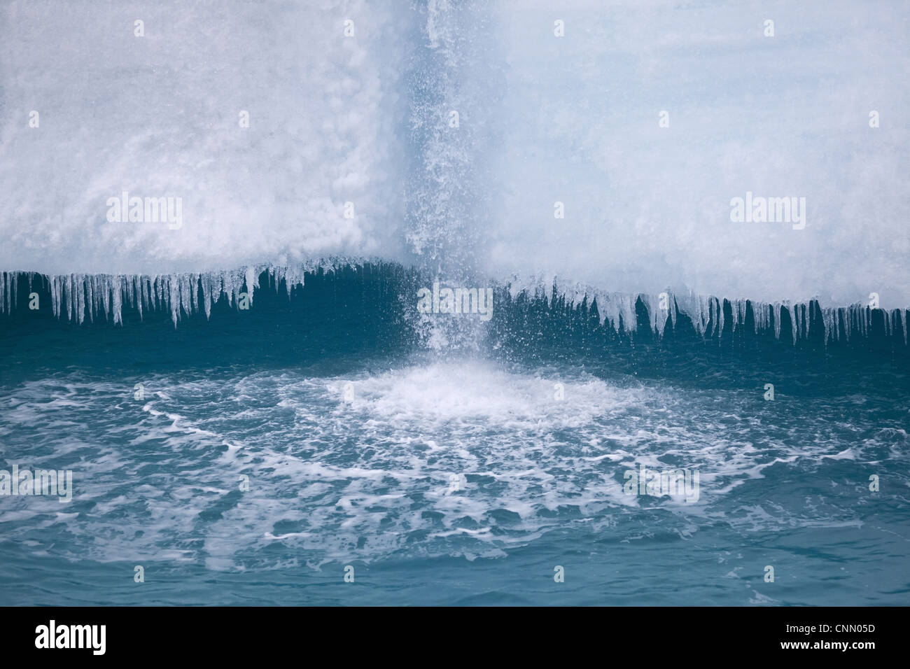 Coastal glacier terminus with waterfall from melting ice, Brasvellbreen ...