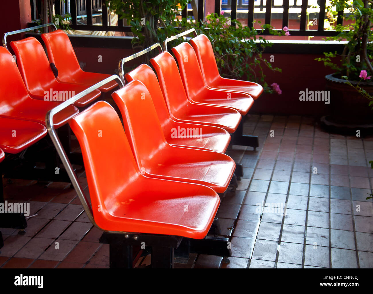 red chair for waiting to travel Stock Photo - Alamy
