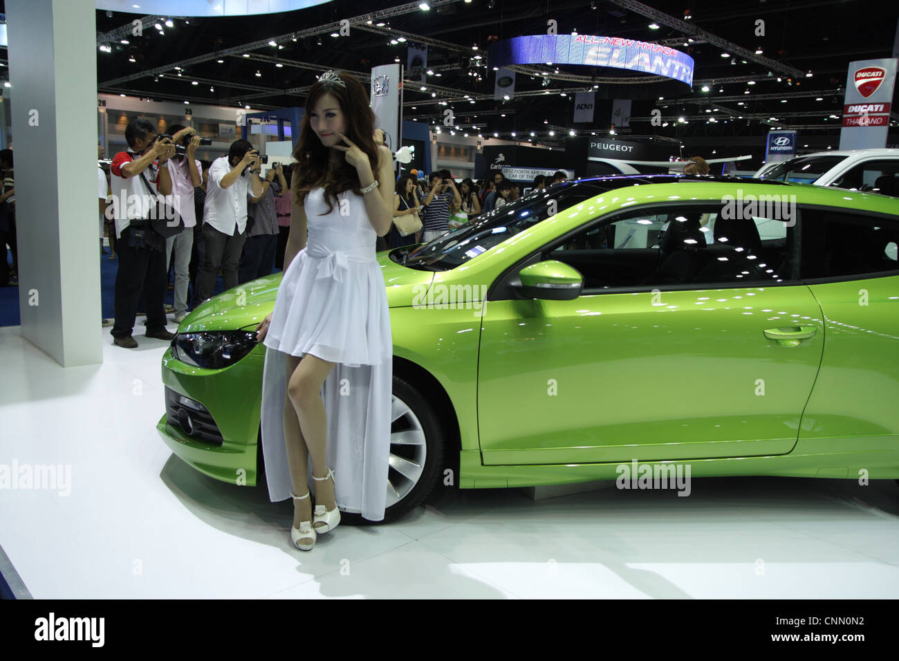 Presenter posing with car in Thailand Motor show 2012 Stock Photo - Alamy