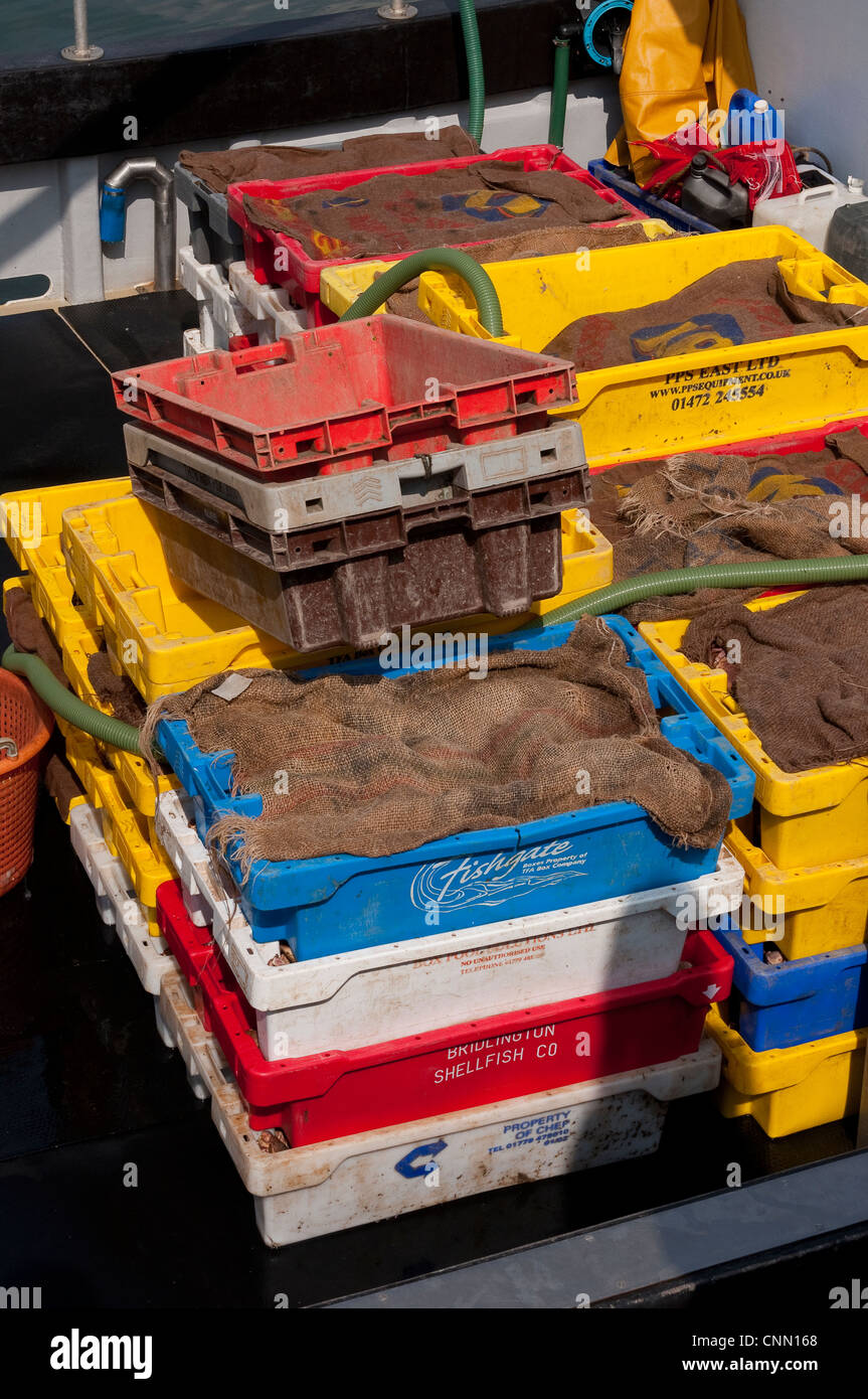 Stacks of empty fish merchants boxes on a boat Stock Photo - Alamy