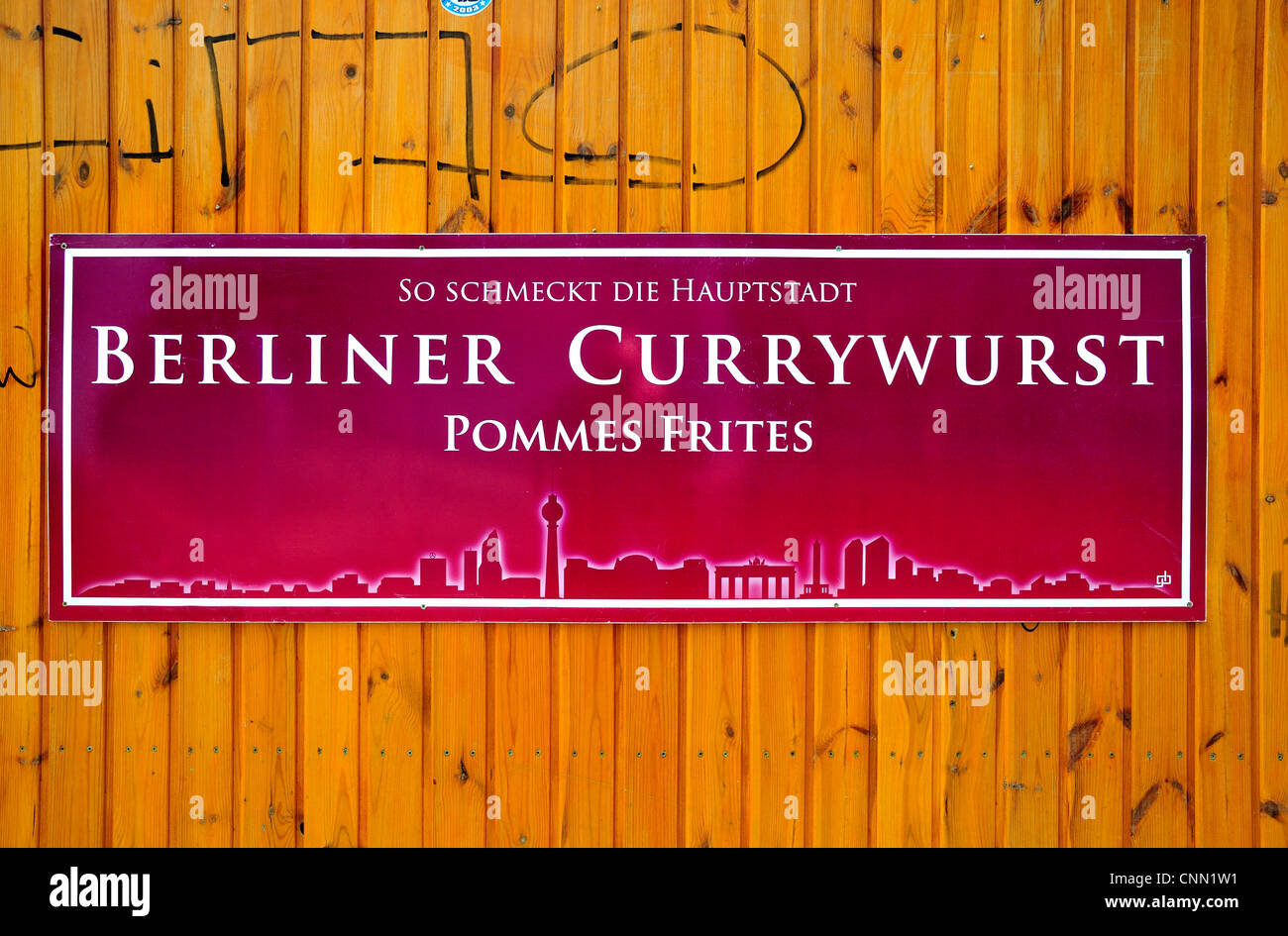 Berlin, Germany. Sign advertising Currywurst and chips. "The Taste of ...