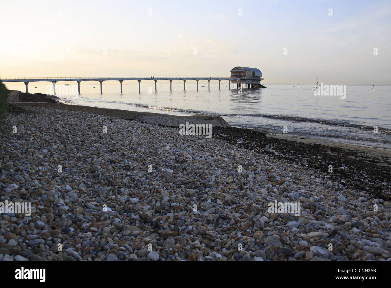 View of beach and lifeboat boathouse at sunset, Bembridge Lifeboat ...