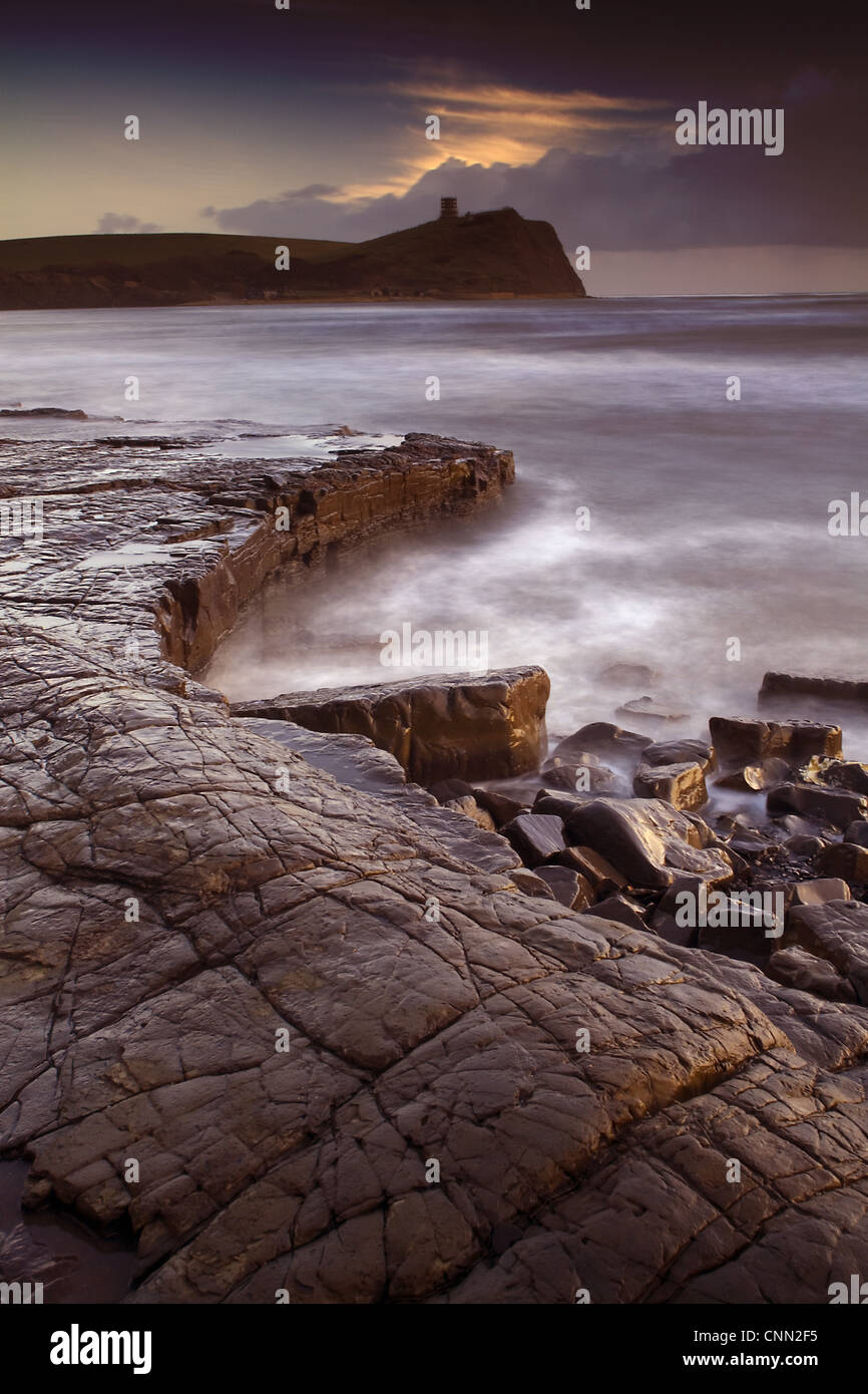 View of wave-cut platform and rocky shore at sunset, The Flats ...