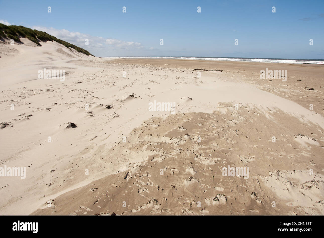 Windblown sand on beach and sand dunes, Bamburgh, Northumberland ...