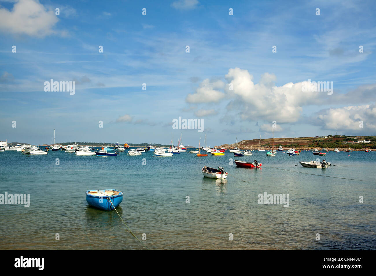 Fishing pleasure boats moored in harbour looking towards Tresco Town ...