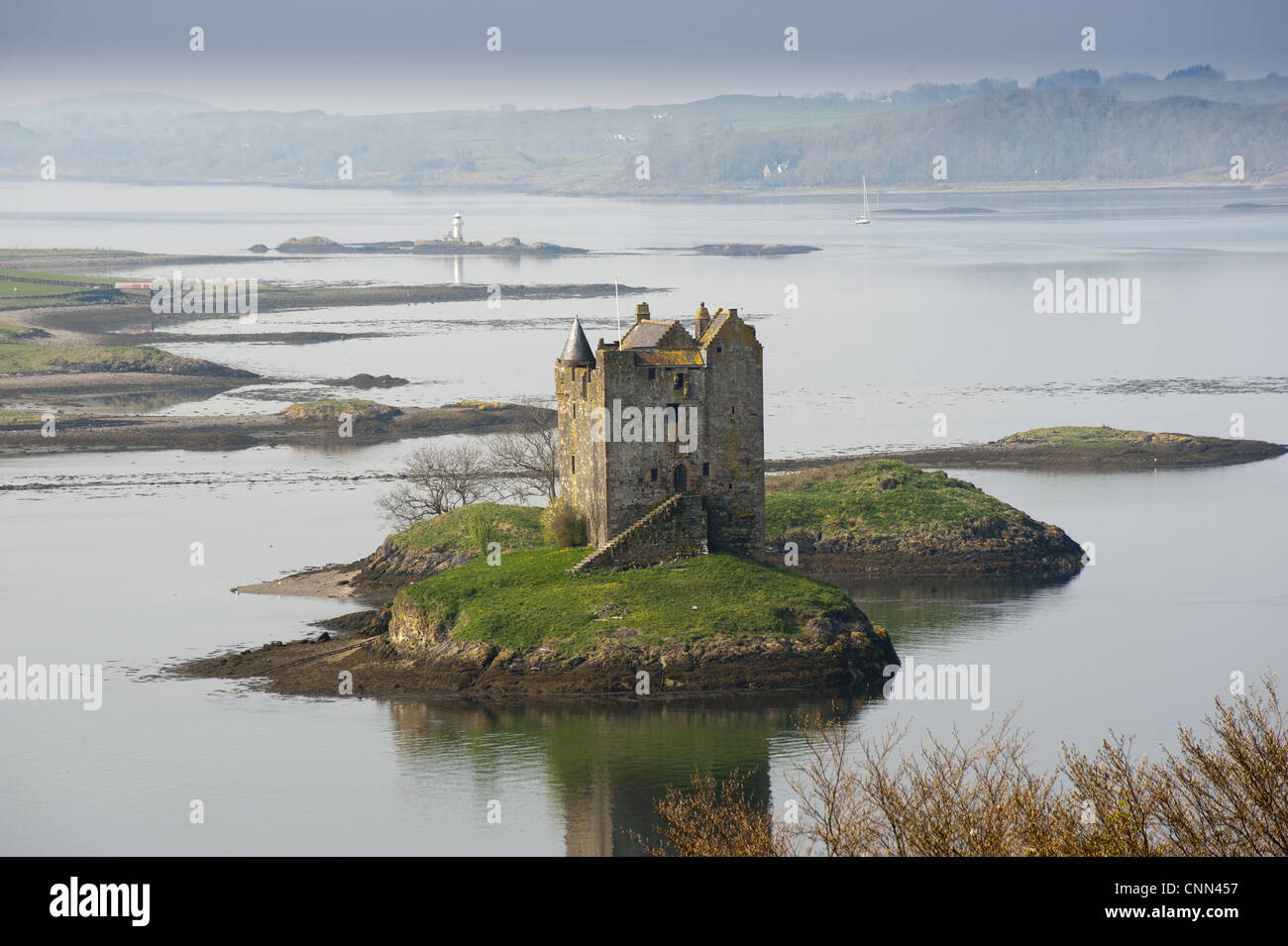 View of medieval towerhouse on tidal islet, Castle Stalker, Loch Linnhe ...